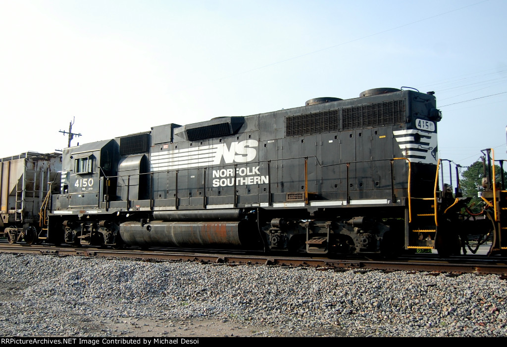 Rare (1 of 5 left on the roster) NS GP-38AC #4150 is the last unit on an eastbound consist about ...